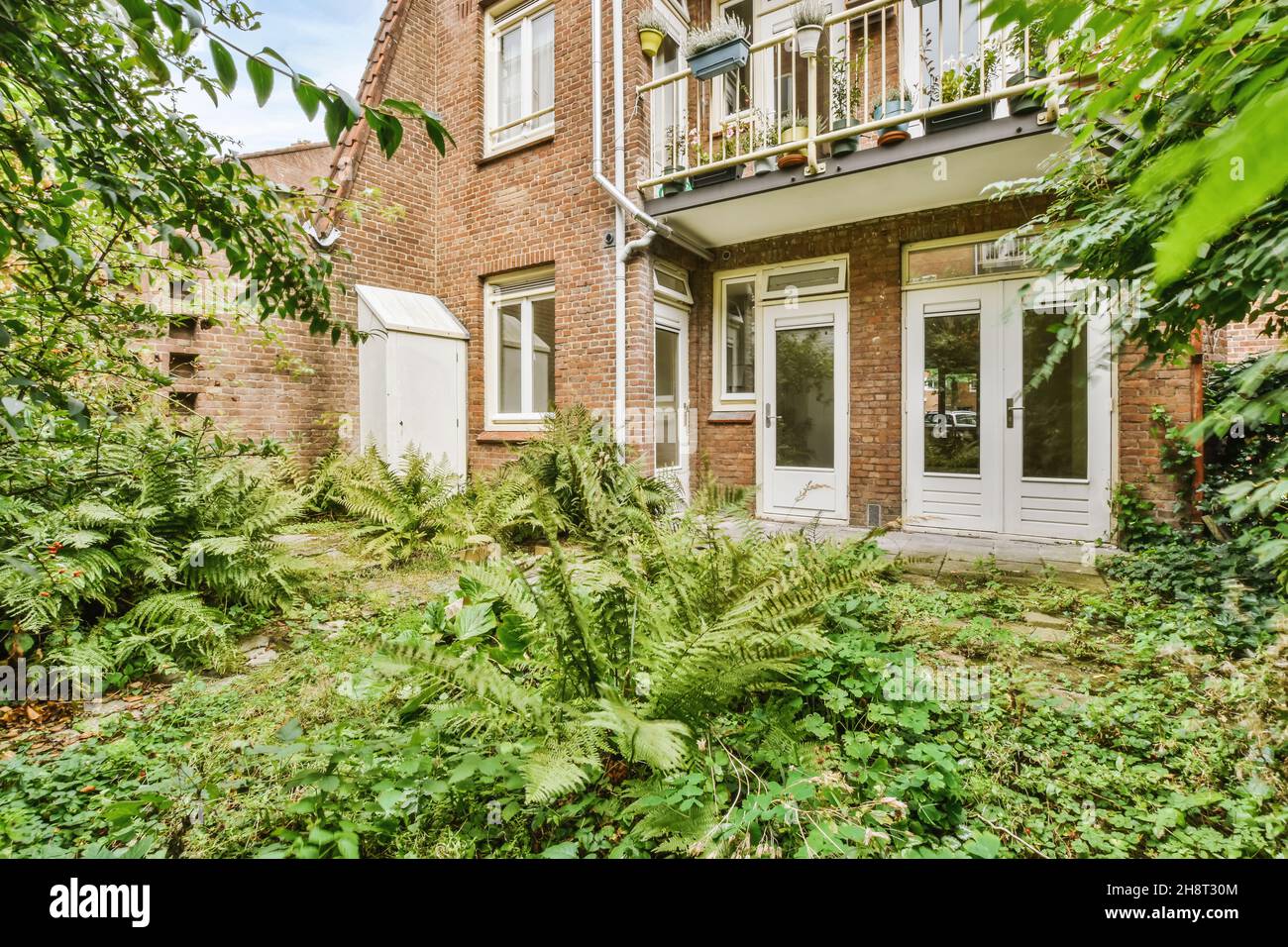 Overgrown courtyard hi-res stock photography and images - Alamy