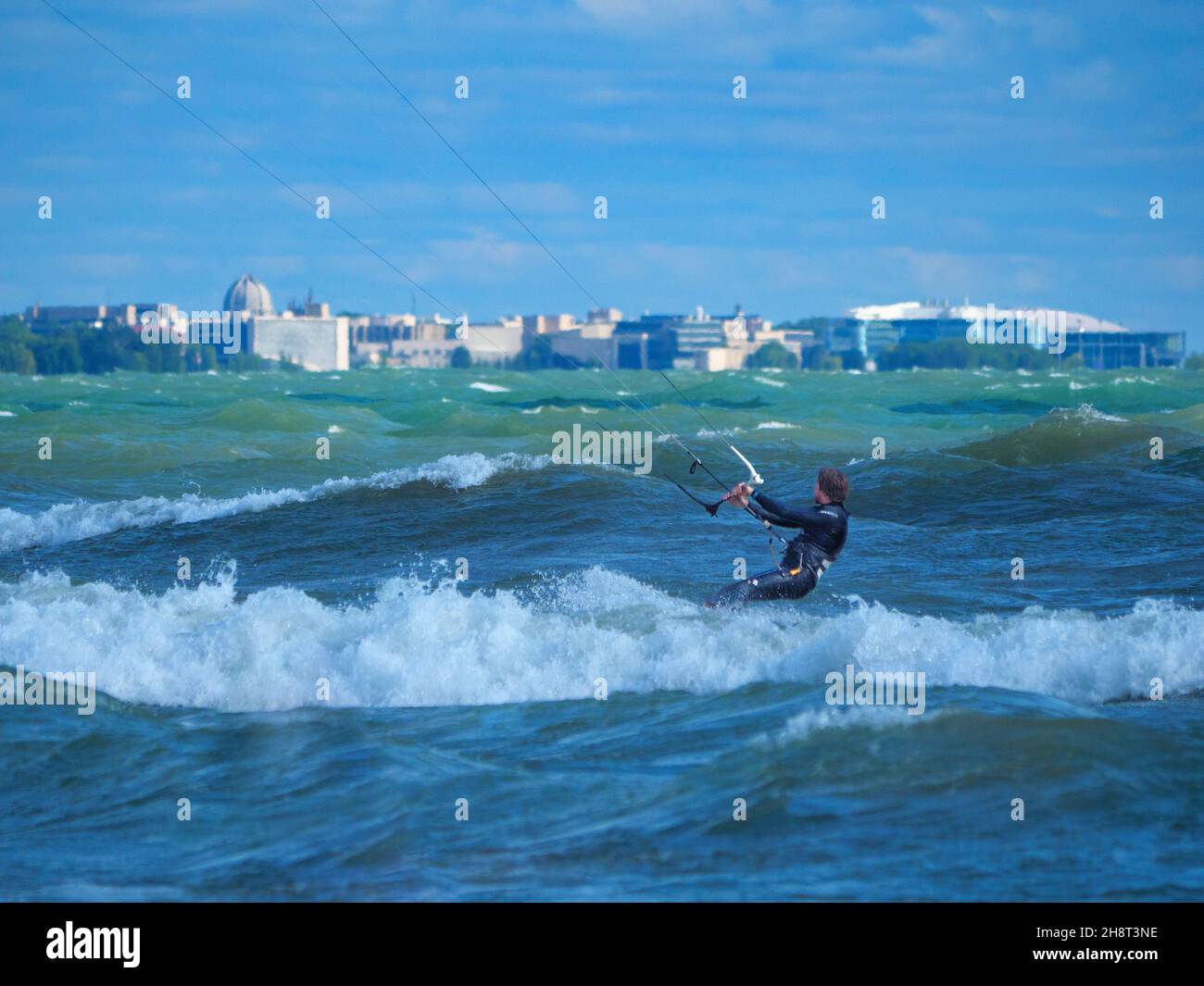 Kite surfer and surf. Montrose Beach, Chicago, Illinois. Baháʼí Temple ...