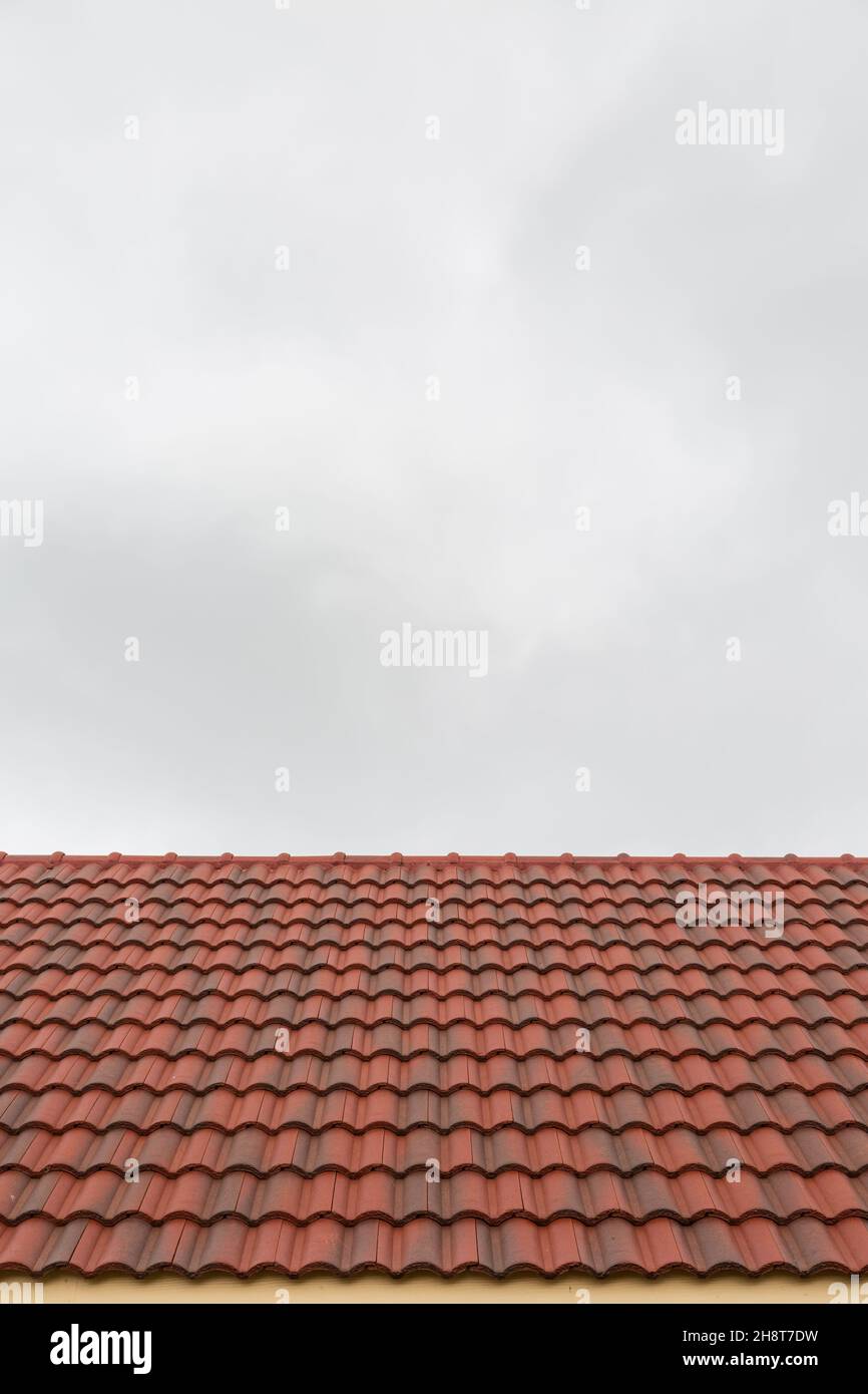 Roof tile pattern over sky background Stock Photo - Alamy