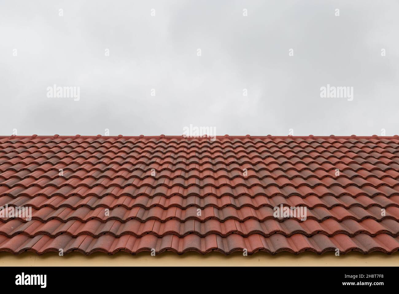 Roof tile pattern over sky background Stock Photo - Alamy
