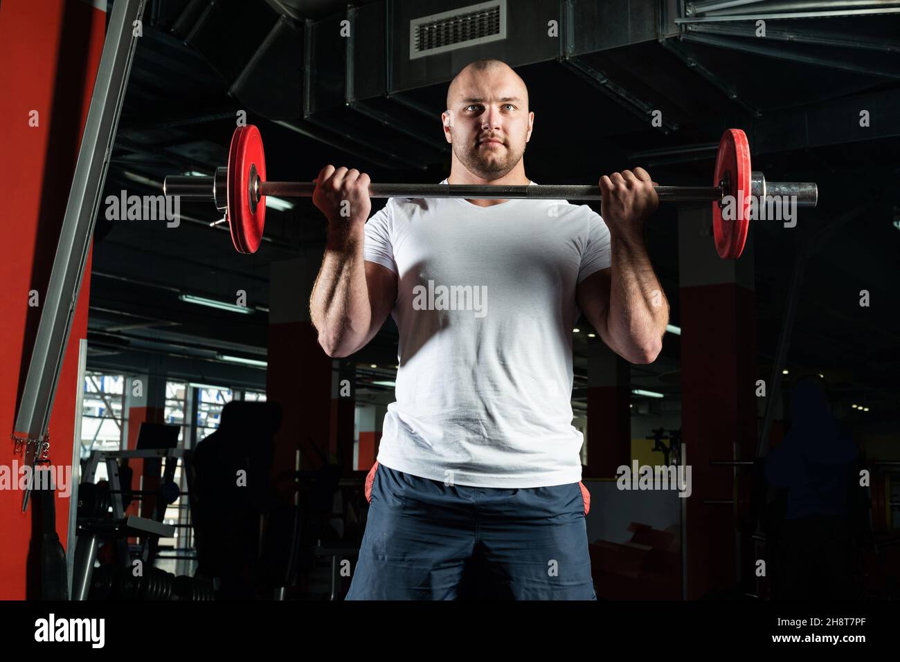 Young athlete lifts heavy barbell hi-res stock photography and images ...