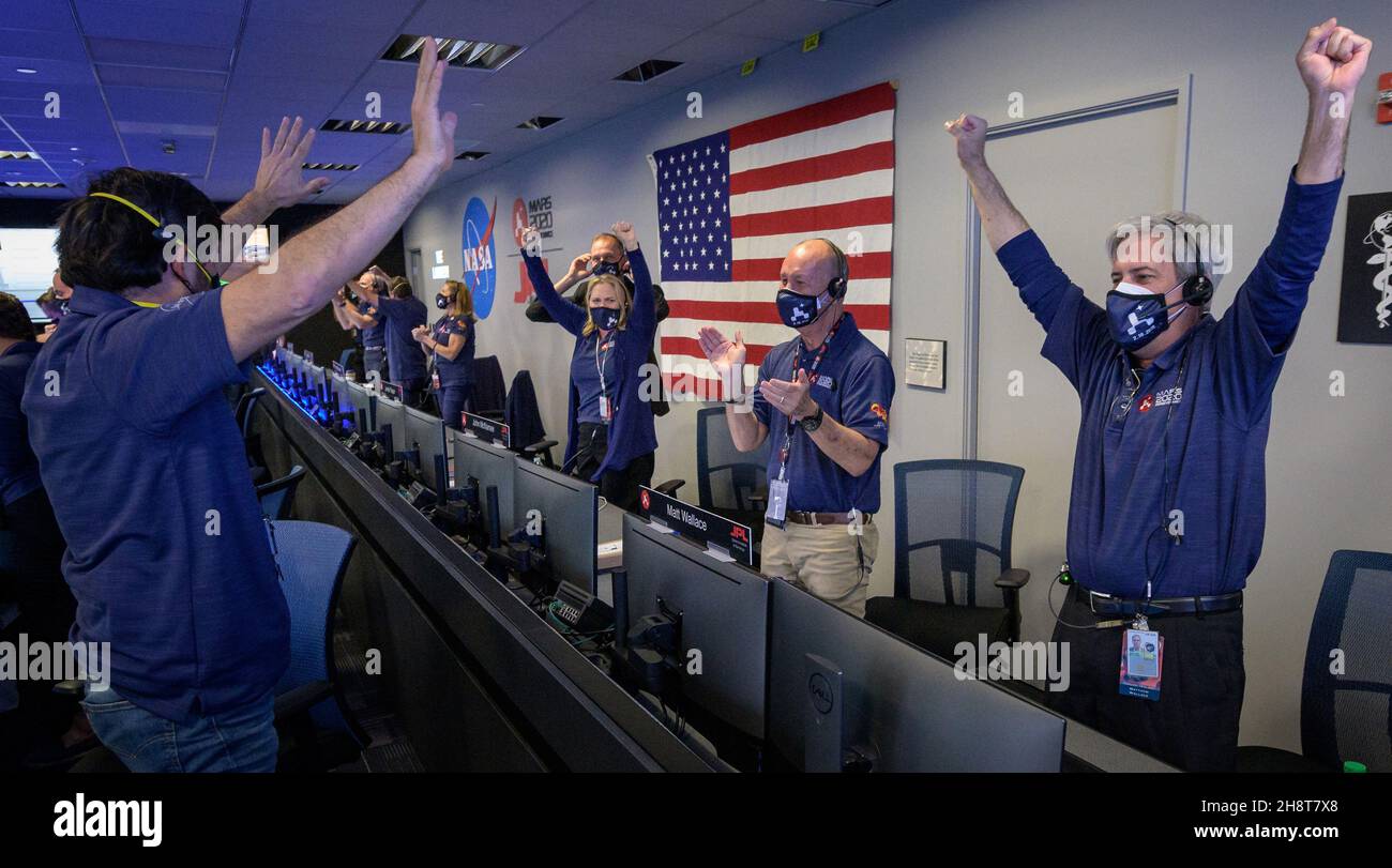 Members of NASA's Perseverance rover team react in mission control ...