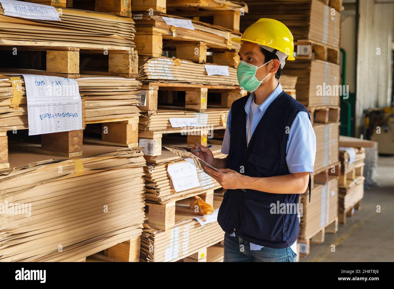 Worker checking raw material in store for factory industrial, Safety ...