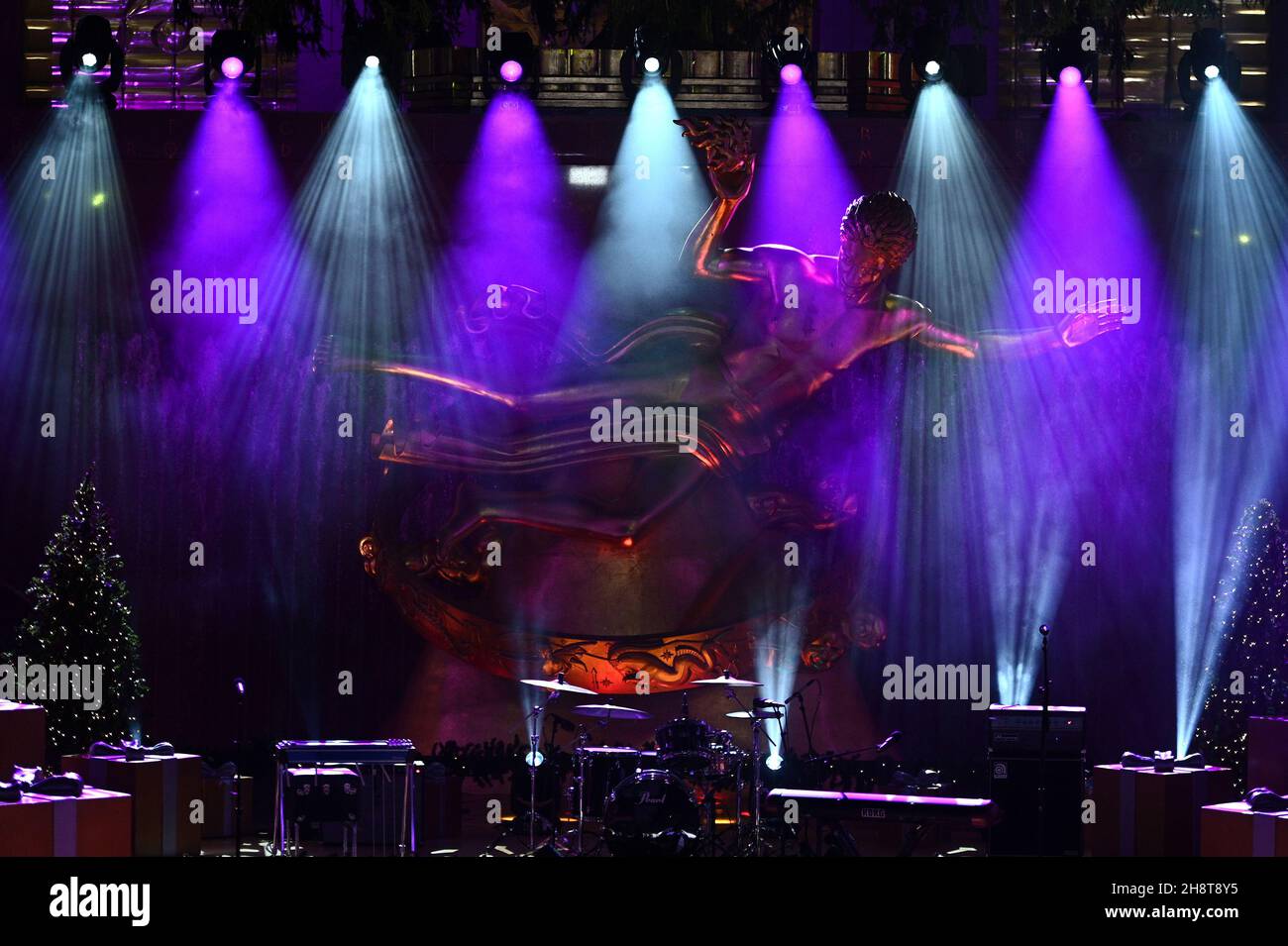 Stage lights shine down over the gilded cast bronze sculpture of ...