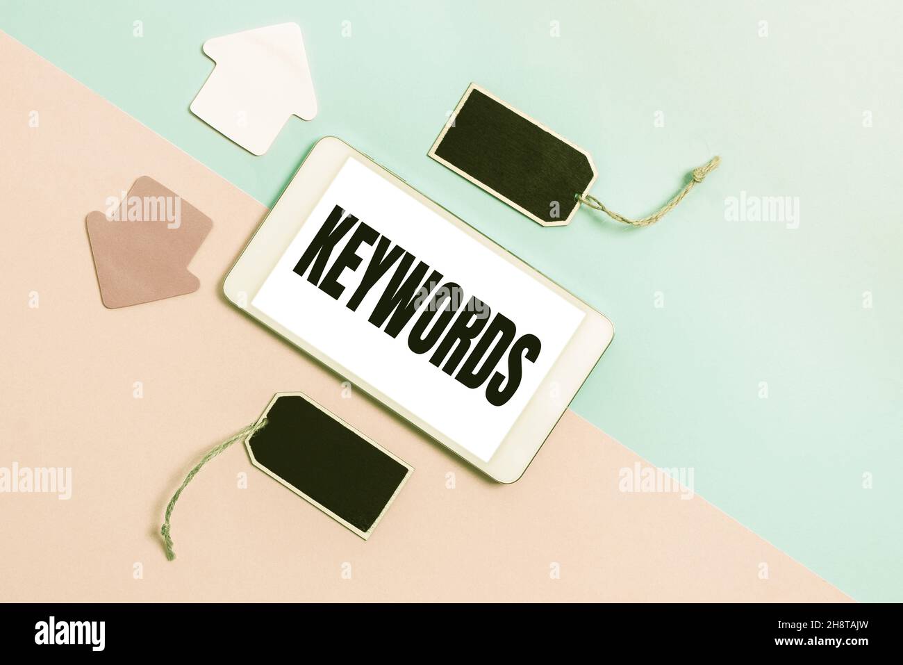 Hand writing sign Keywords. Internet Concept word which acts as the key ...