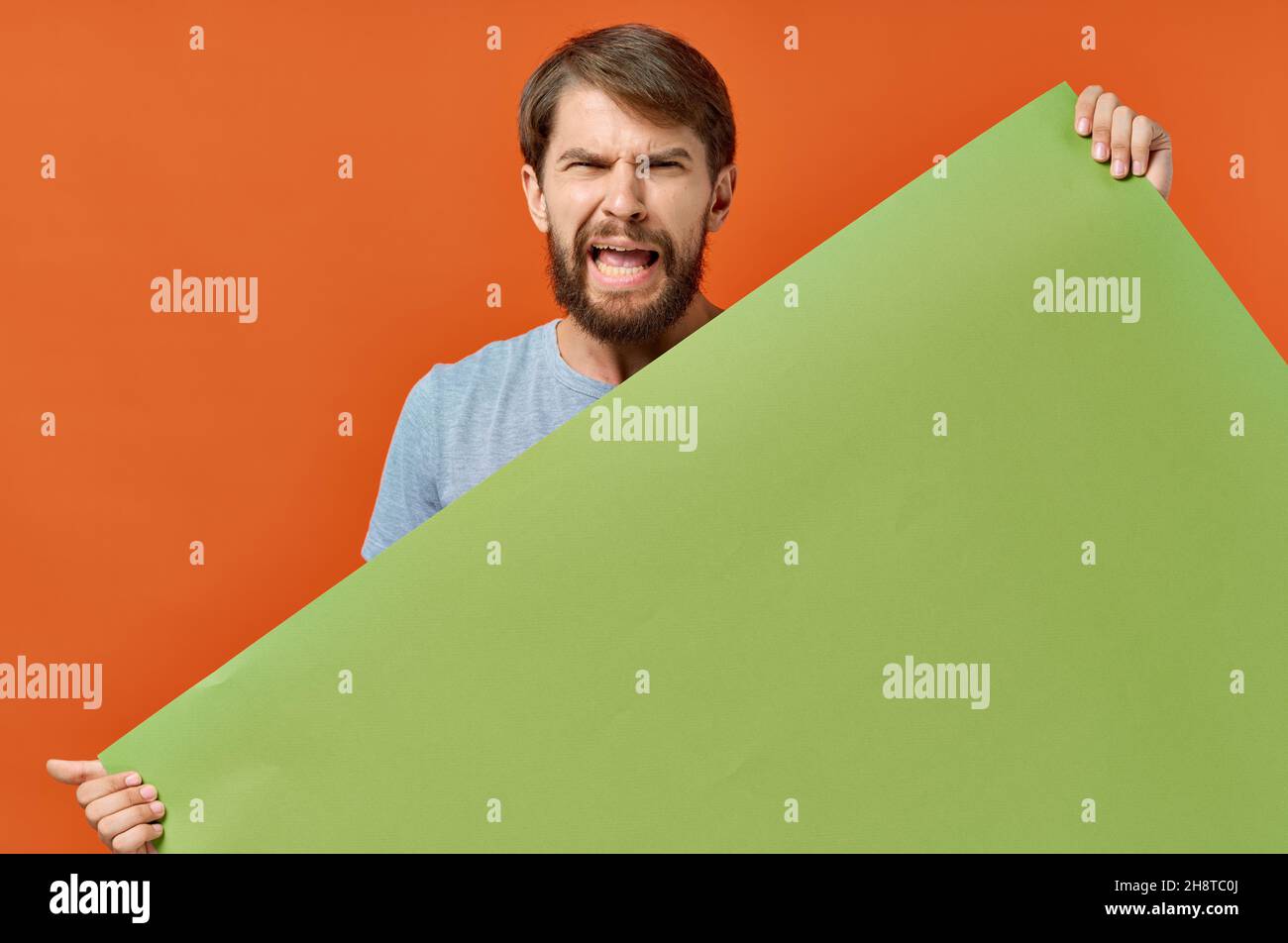 funny man holding a green banner design isolated background Stock Photo ...