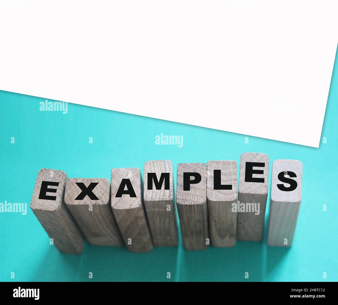 Examples word written on wooden blocks. Education or storytelling ...