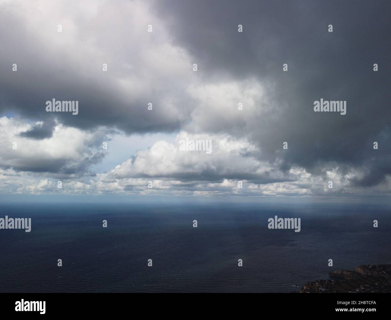 Abstract airy sky with moving plump clouds over the sea ocean. Small ...