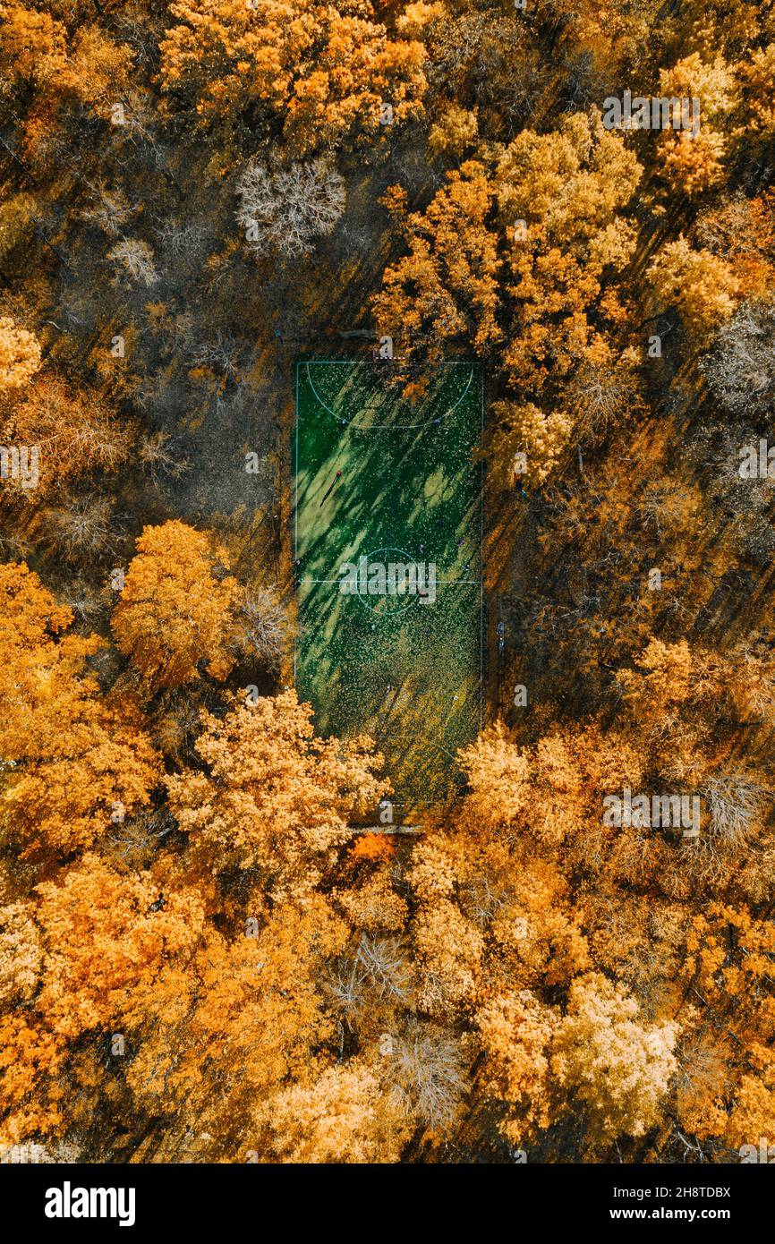 Drone top down view of beautiful shcool football field in autumn ...