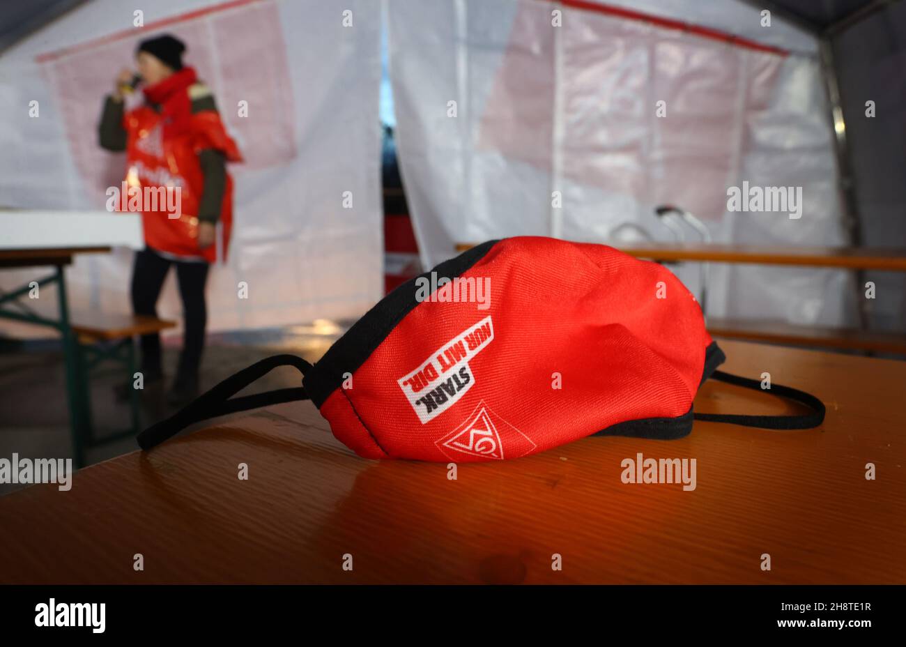 Augsburg, Germany. 02nd Dec, 2021. An IG Metall striker stands in a ...