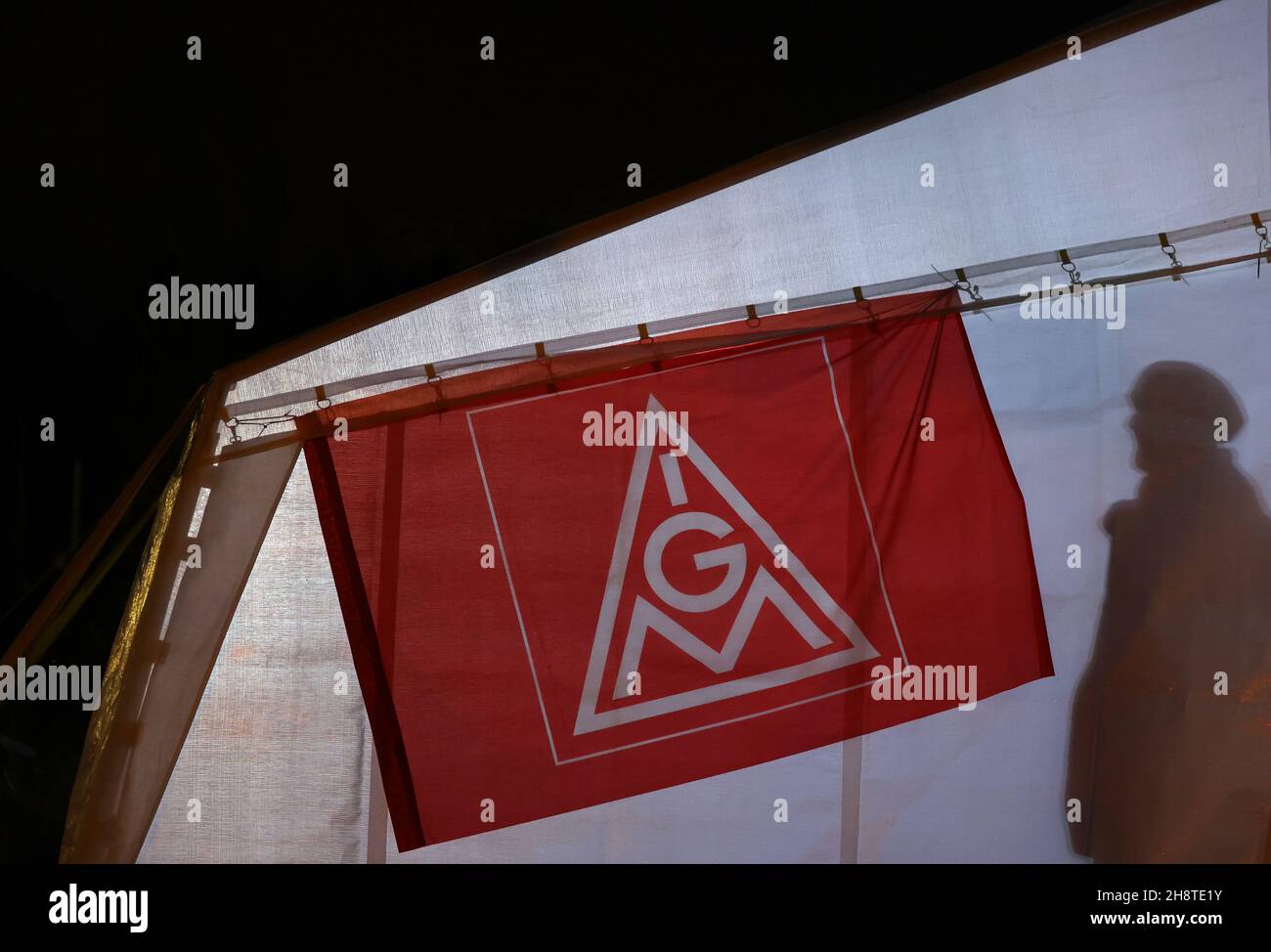 Augsburg, Germany. 02nd Dec, 2021. A striker of IG Metall stands in a ...