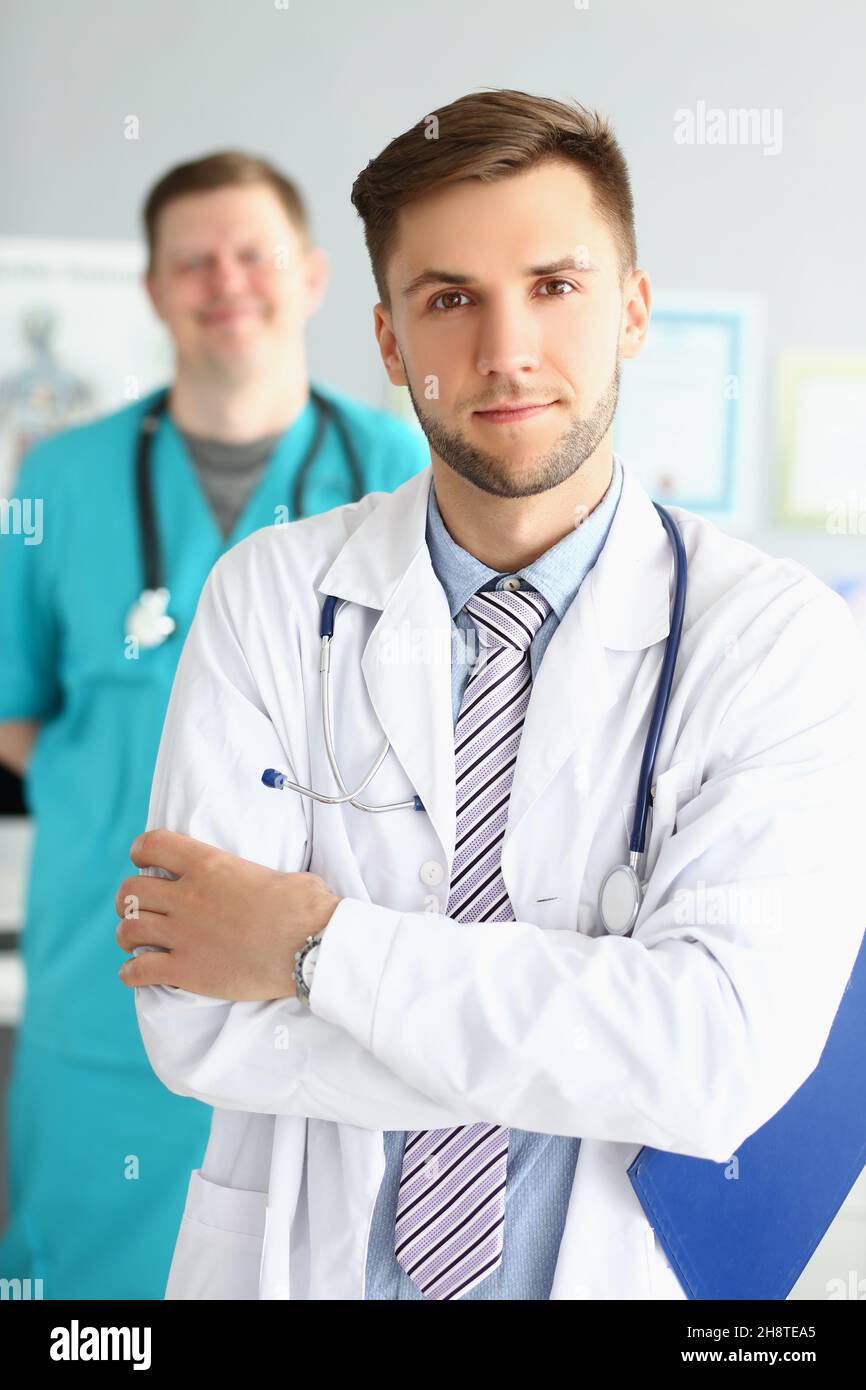 Two male medical workers in uniform at the workplace Stock Photo - Alamy