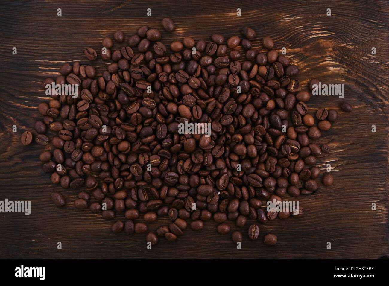 Coffee beans on an old rustic background Stock Photo - Alamy