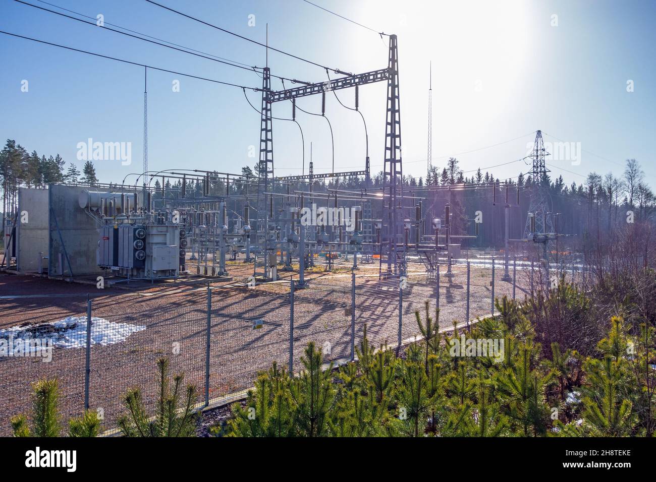 Electrical substation with a fence in the forest Stock Photo - Alamy