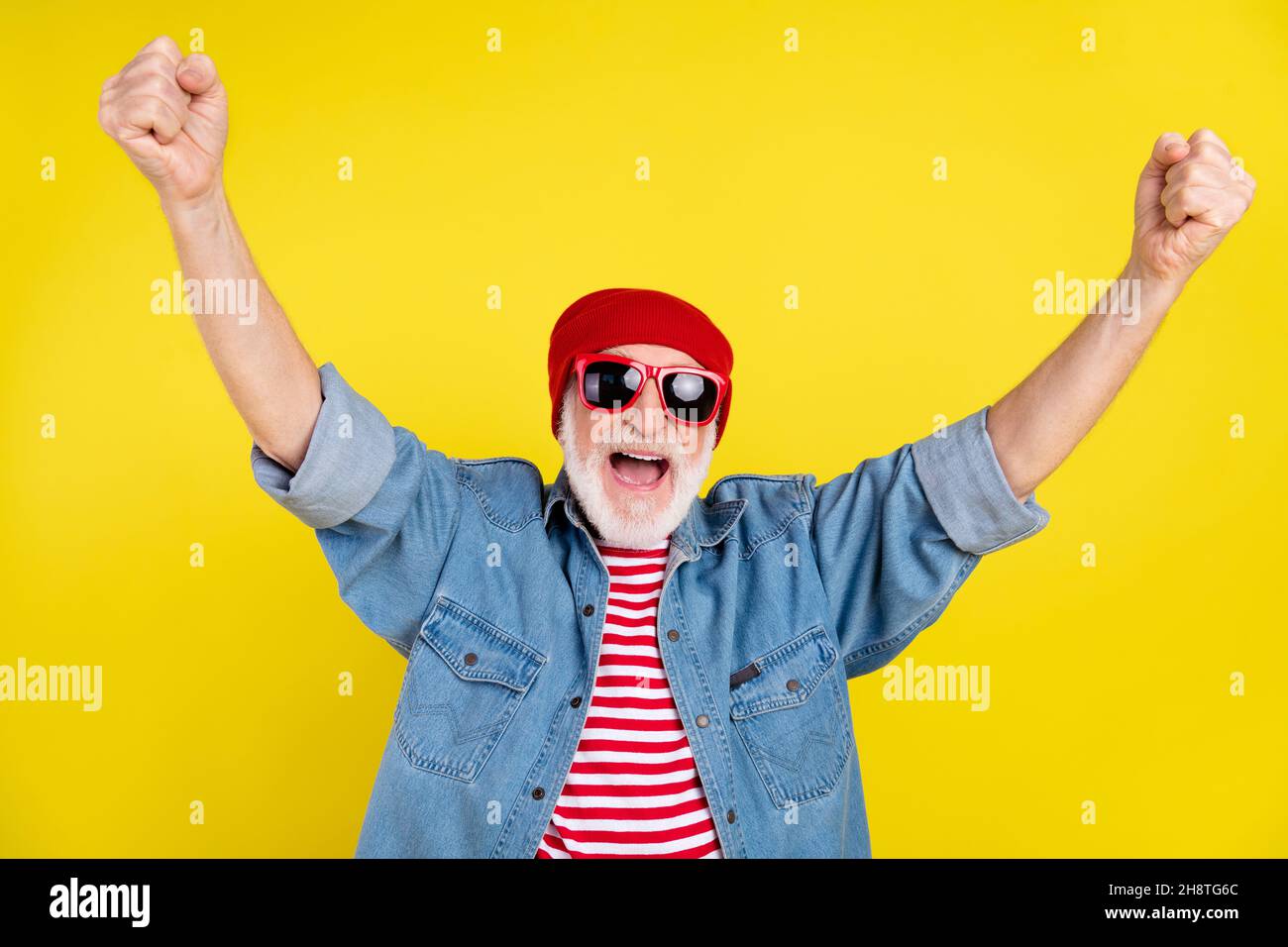 Portrait of attractive cheerful comic grey-haired man rejoicing having ...