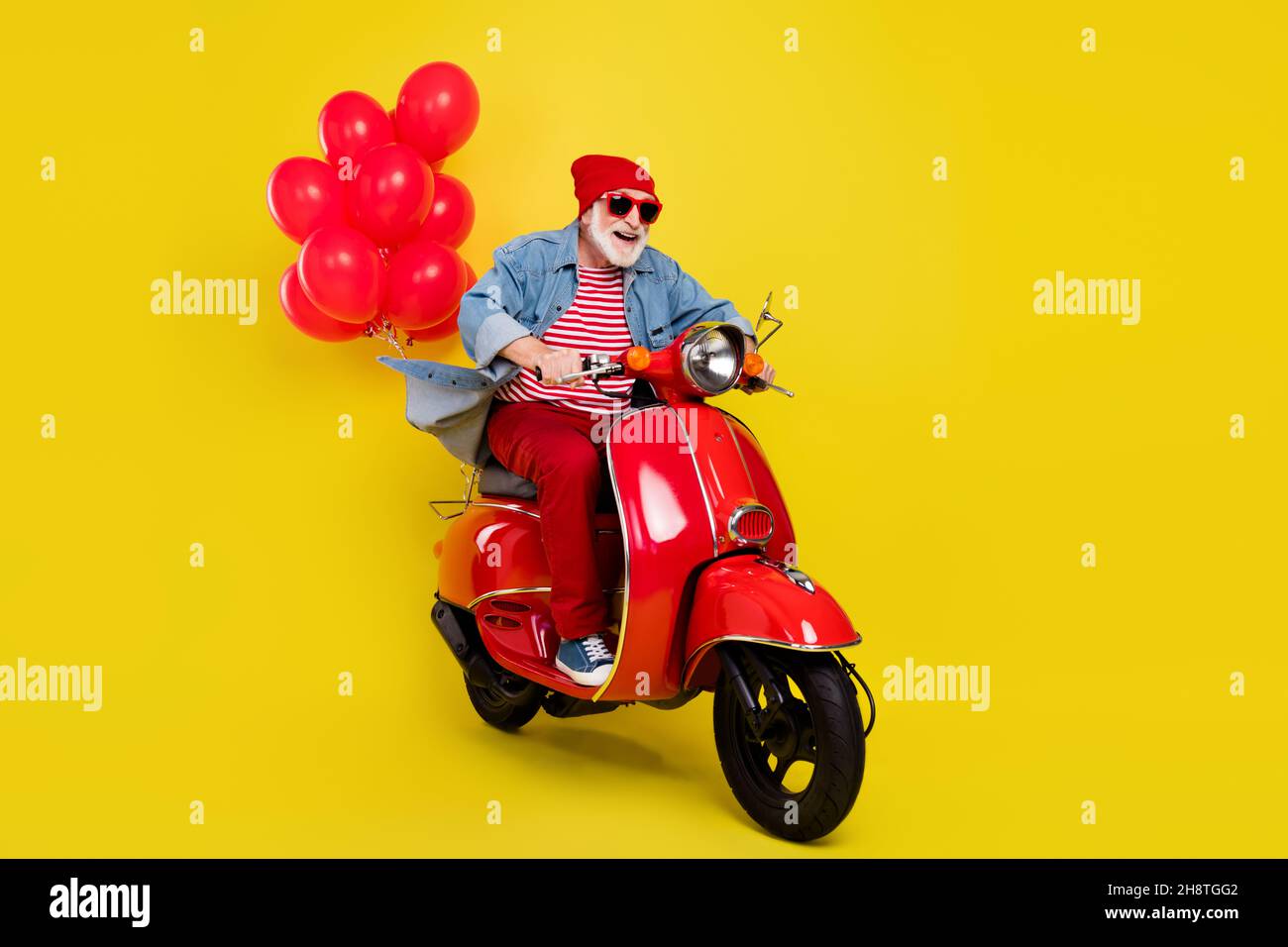 Portrait of elderly retired pensioner cheerful man riding moped having ...