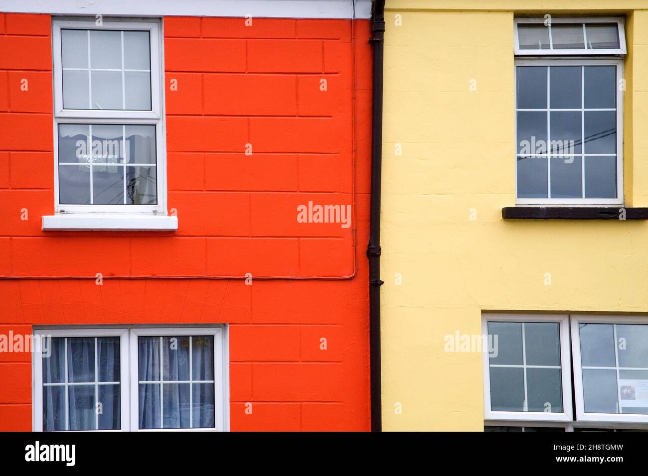 brightly coloured buildings in the village af sneem in southern ireland ...