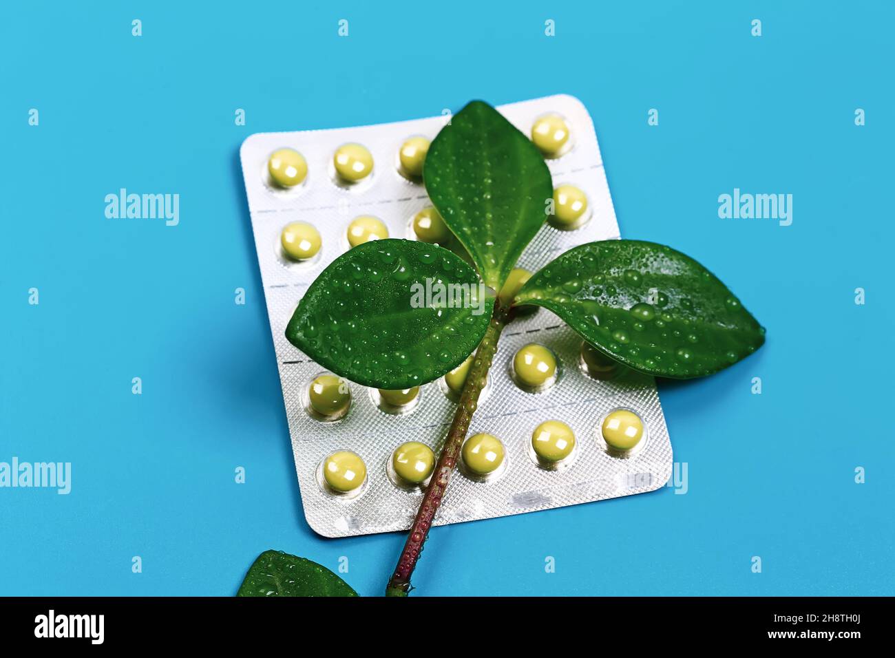 medical concept. homeopathic medicine on a blue background. tablets ...