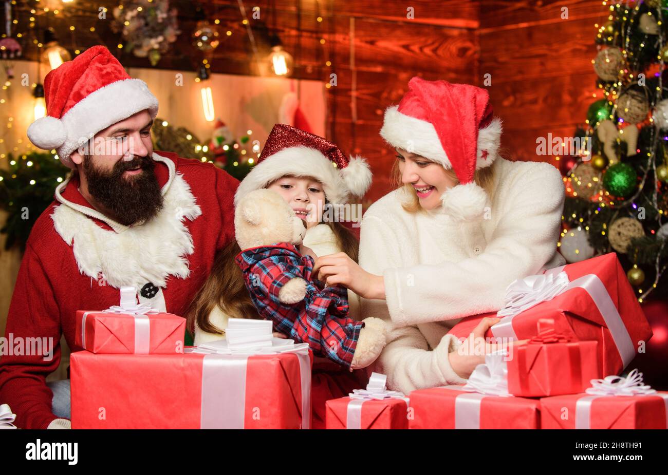 Christmas traditions concept. Father Santa claus costume with mom and ...