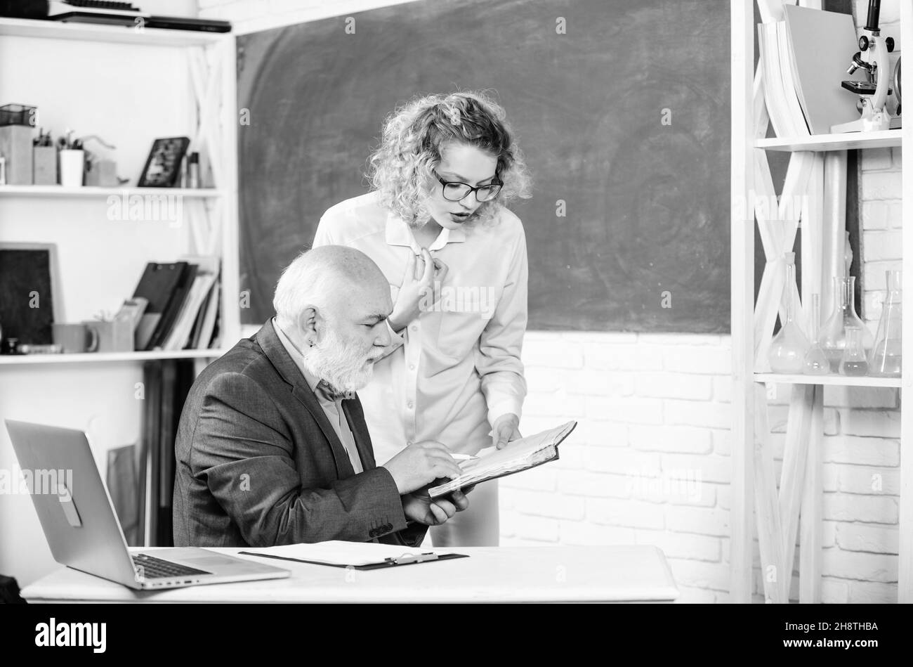 Solving math tasks. School education concept. Check homework. Educator ...