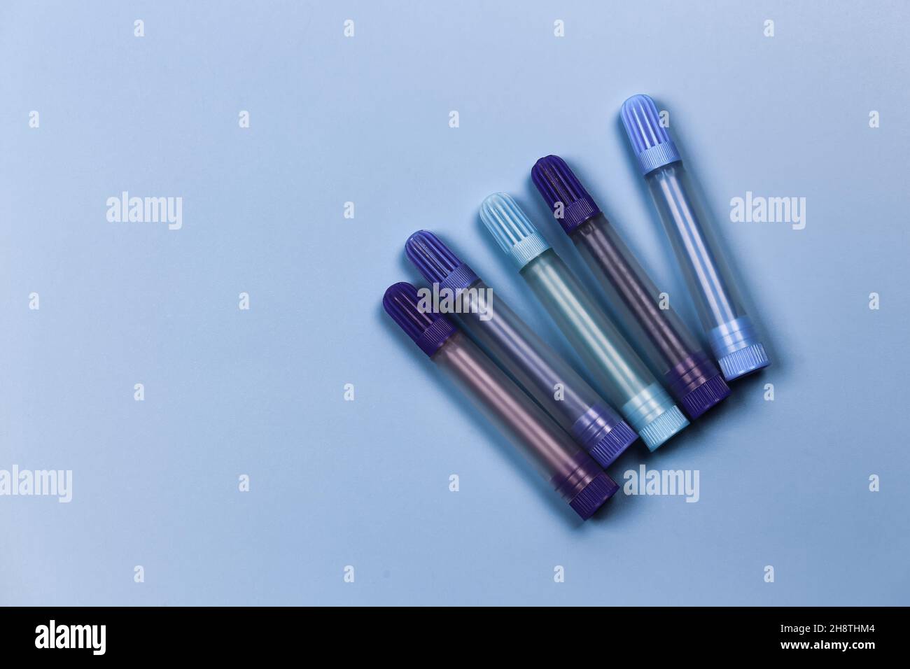 blue felt-tip pens of different shades on a light blue background Stock ...