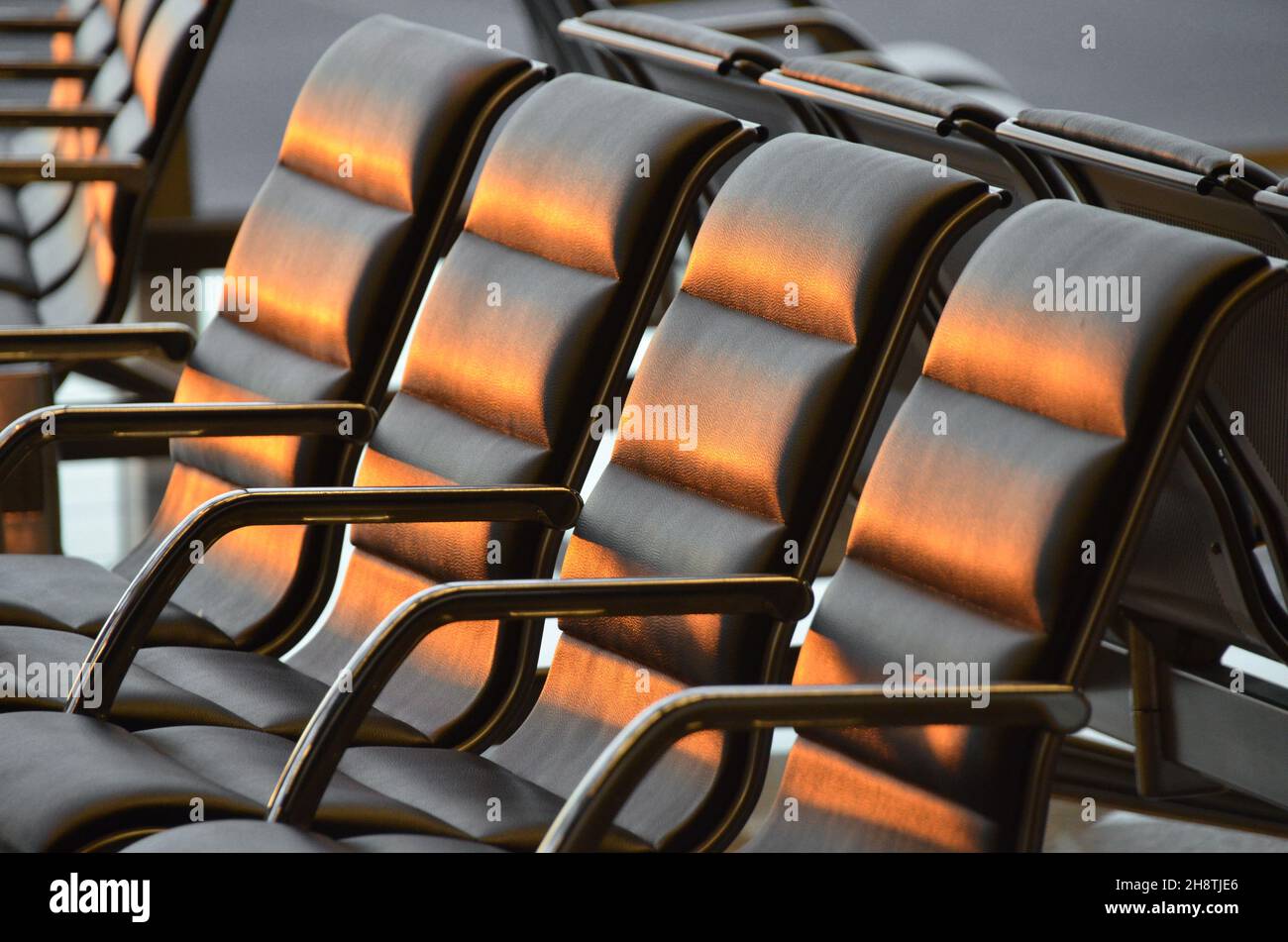 bench in the hall of airport Stock Photo - Alamy