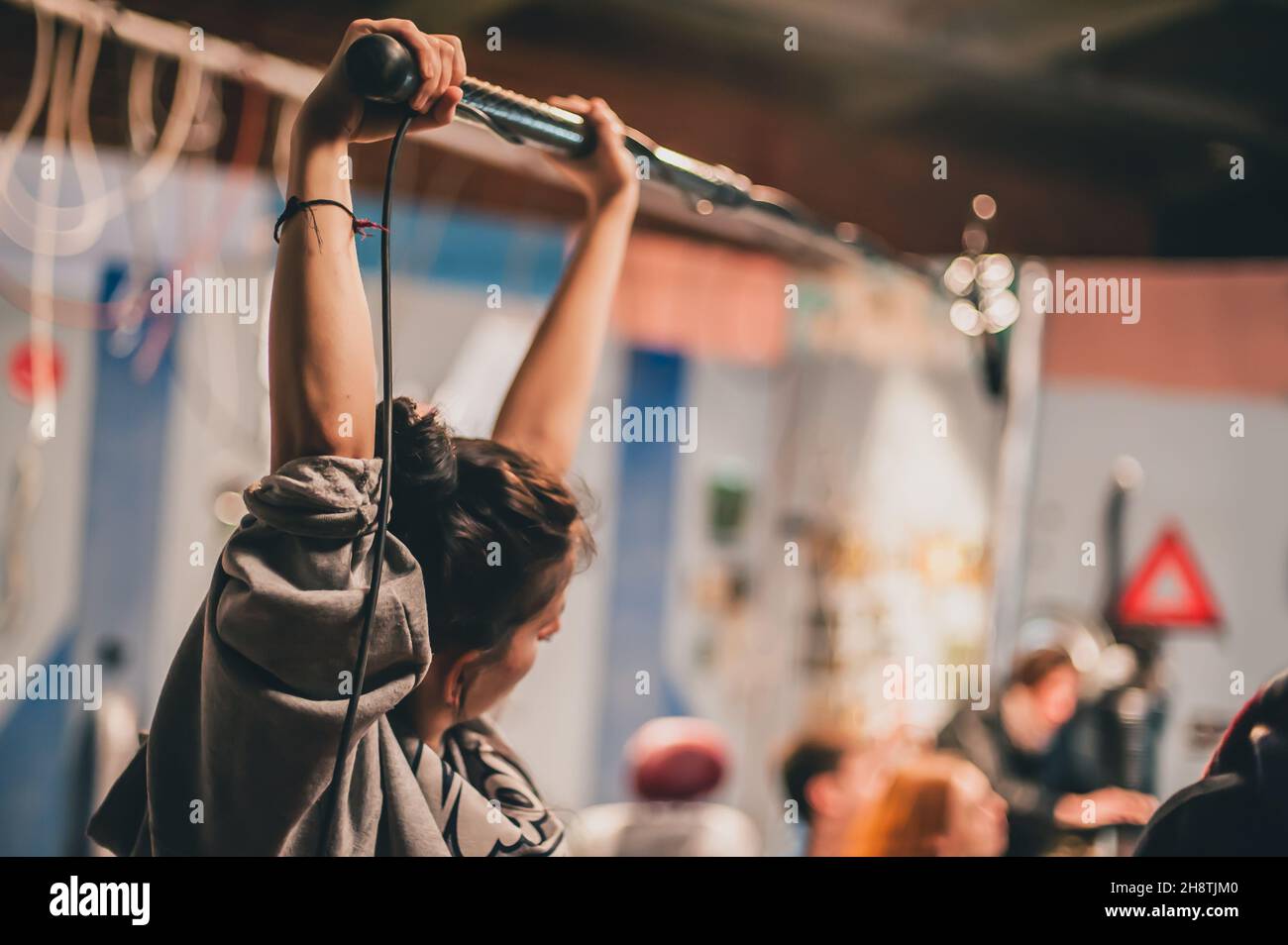 Actor behind the scene. Sound boom operator hold microphone fisher in ...