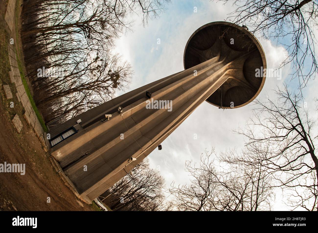 Tower tank for water supply in the forest. Fisheye lens perspective ...