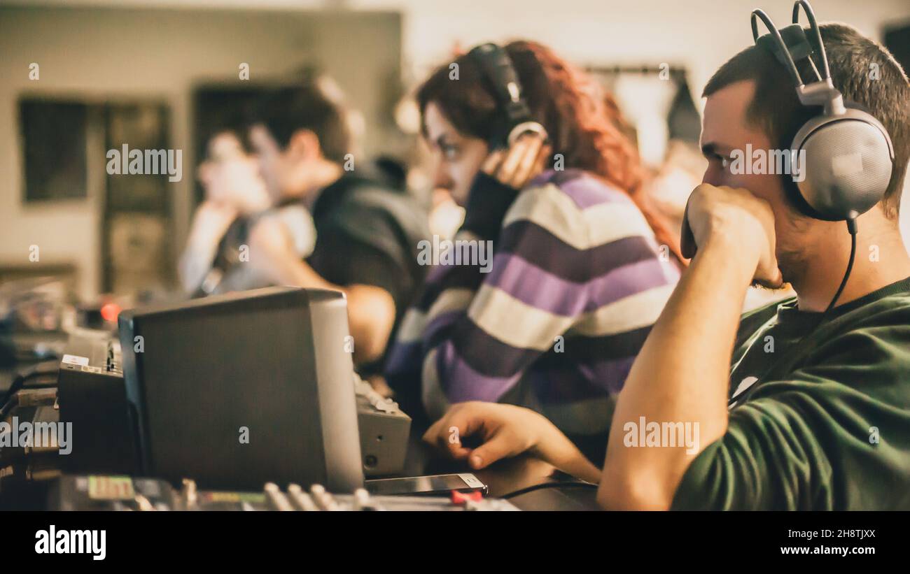 Behind the scene. Film crew in studio for film montage. Analog and ...