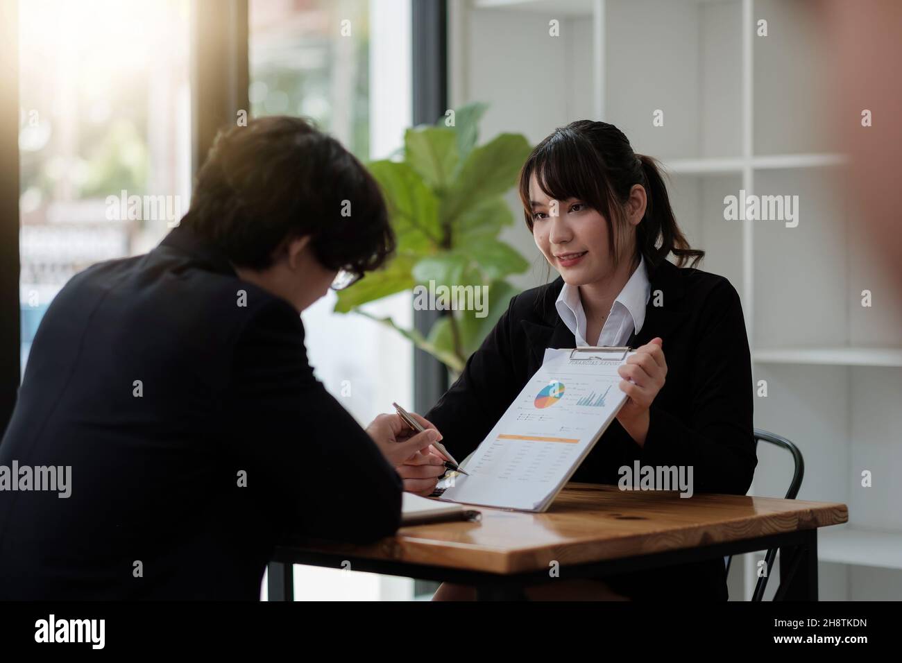 business people discussing the charts and graphs showing the results of ...