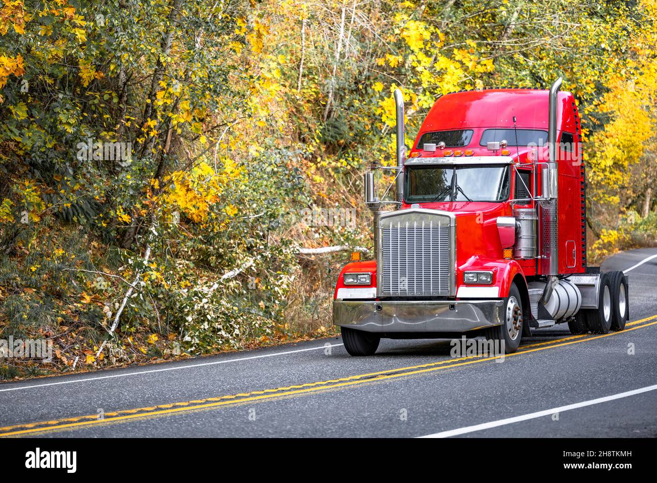 Industrial powerful bright red big rig semi truck tractor without semi ...