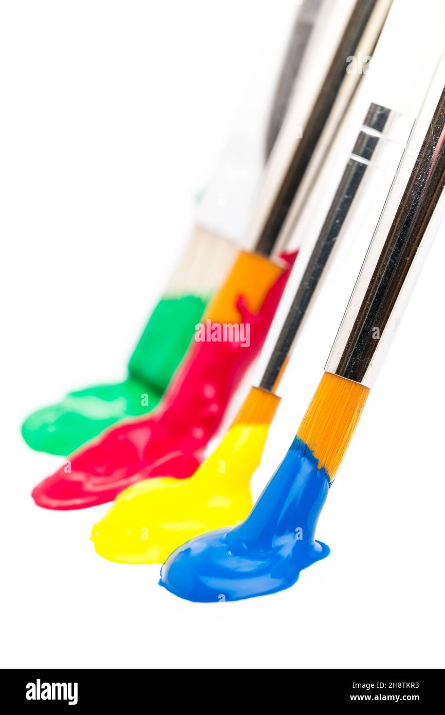 Colorful brushes painting on white paper Stock Photo - Alamy