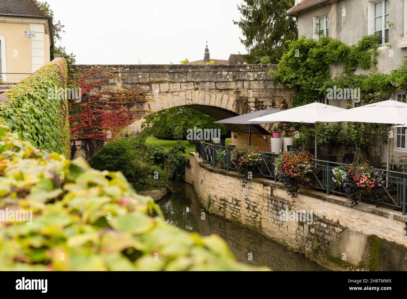 Ancient stone bridge in water channel in Dole , France Stock Photo - Alamy