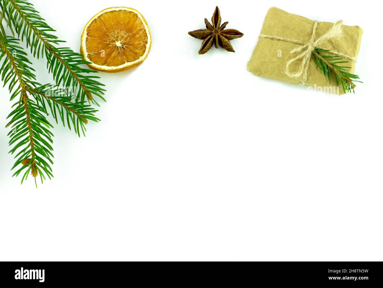 Christmas Happy New Year background. Spruce gift orange anise on white ...