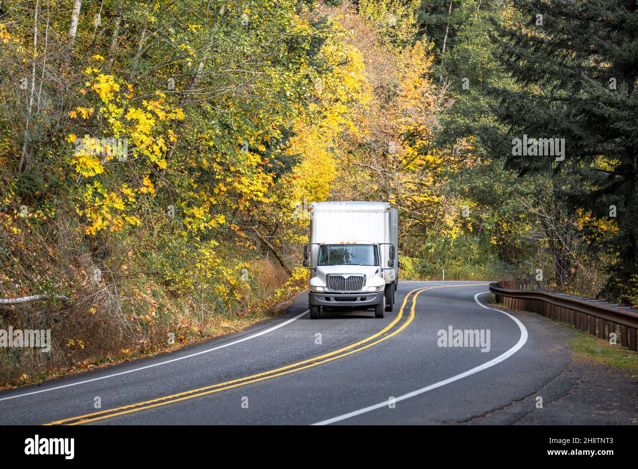 Industrial medium power day cab white rig semi truck transporting ...