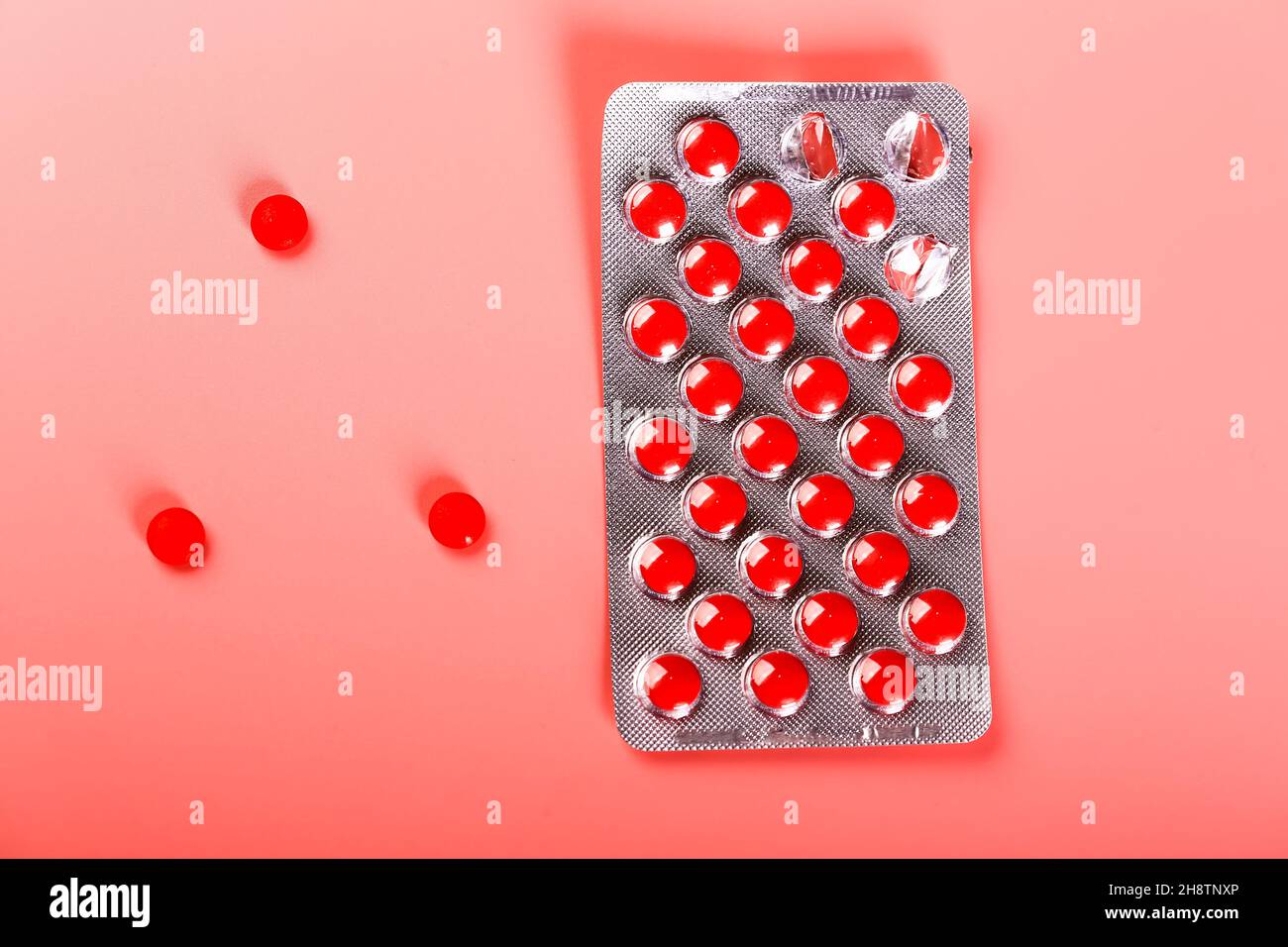 Red tablets pills with a red color hi-res stock photography and images ...