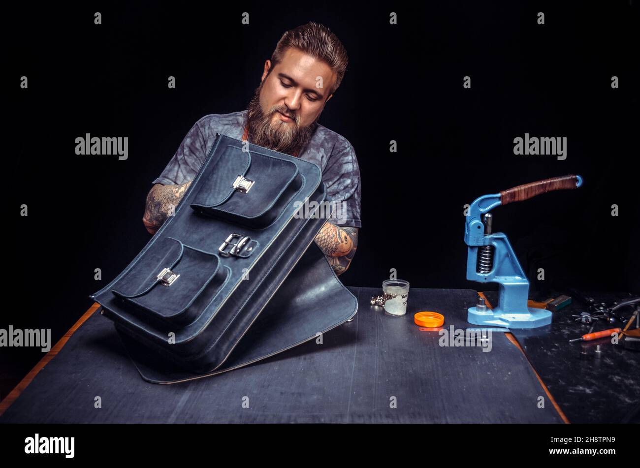 Leather Artist producing leather workpiece in workshop Stock Photo - Alamy