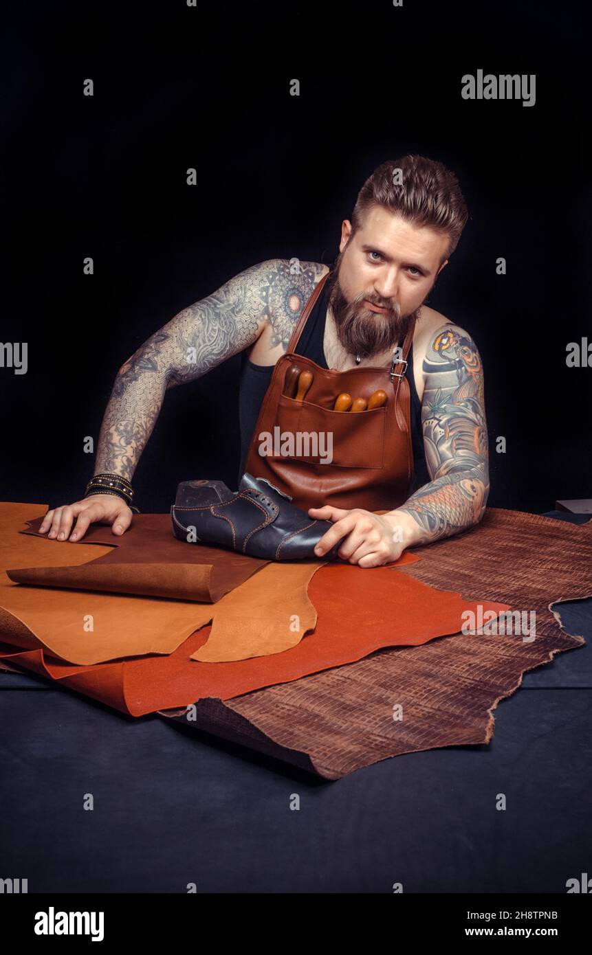 Leather Professional works with leatherwork in the place of work Stock ...