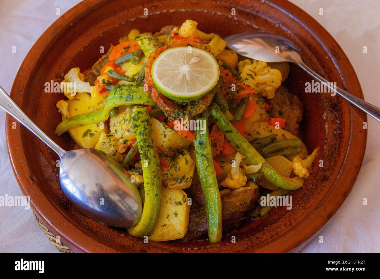 Tajine with vegetables. A tajine or tagine is a North African dish ...