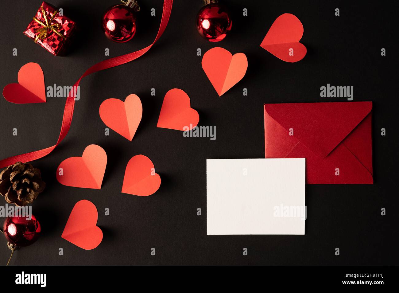 White paper and red heart paper pasted on a black background Stock ...
