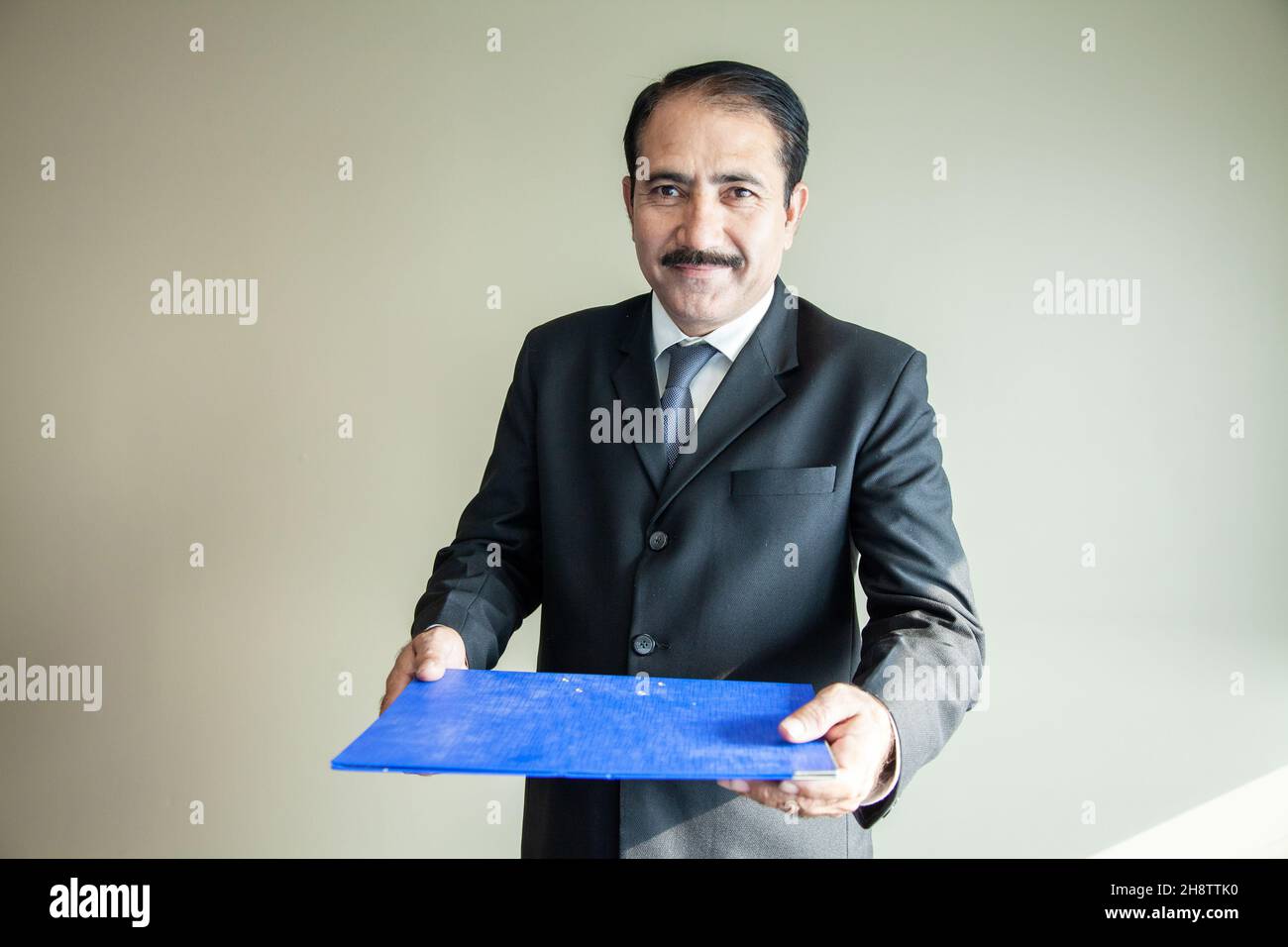 Old executive with moustache awarding business proposal Stock Photo - Alamy