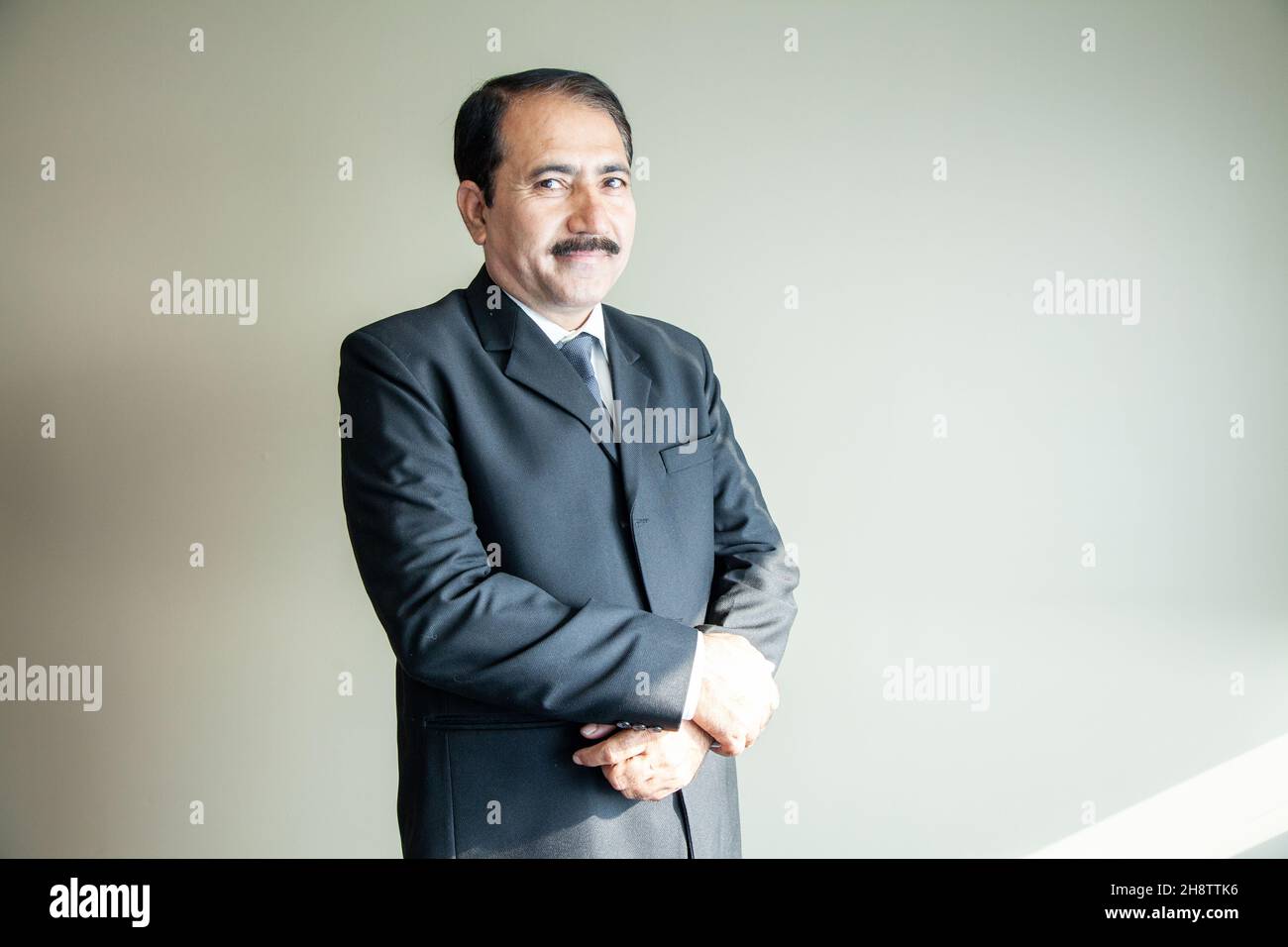 Mature senior company director CEO holding hand portrait Stock Photo ...