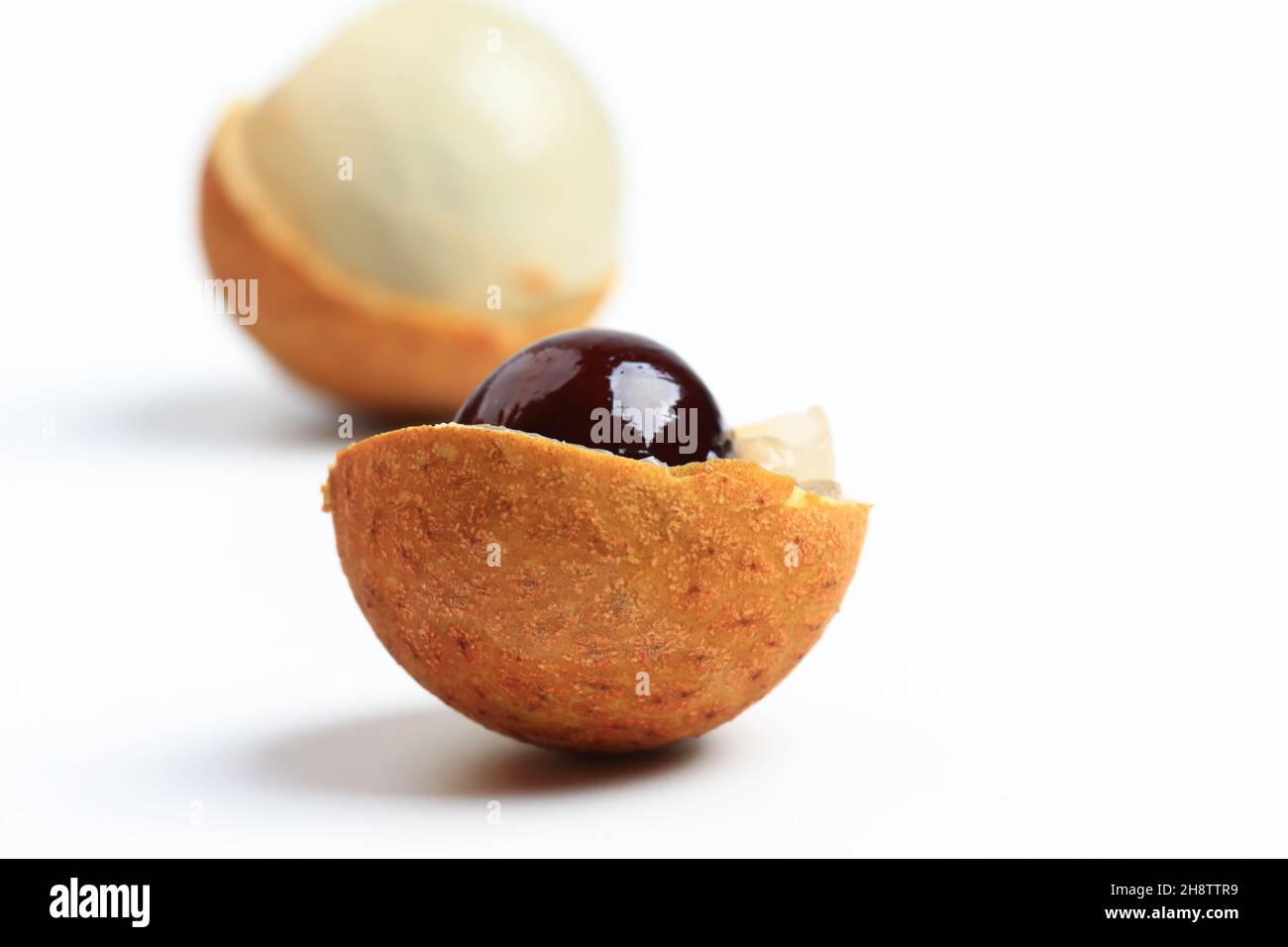 Lychee cut on white background Stock Photo - Alamy