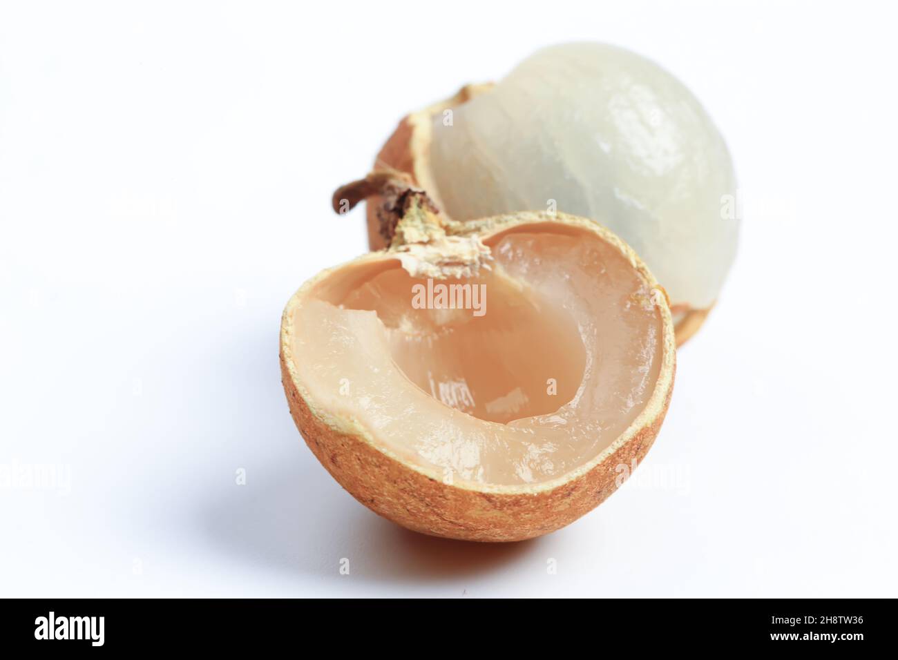Lychee cut on white background Stock Photo - Alamy