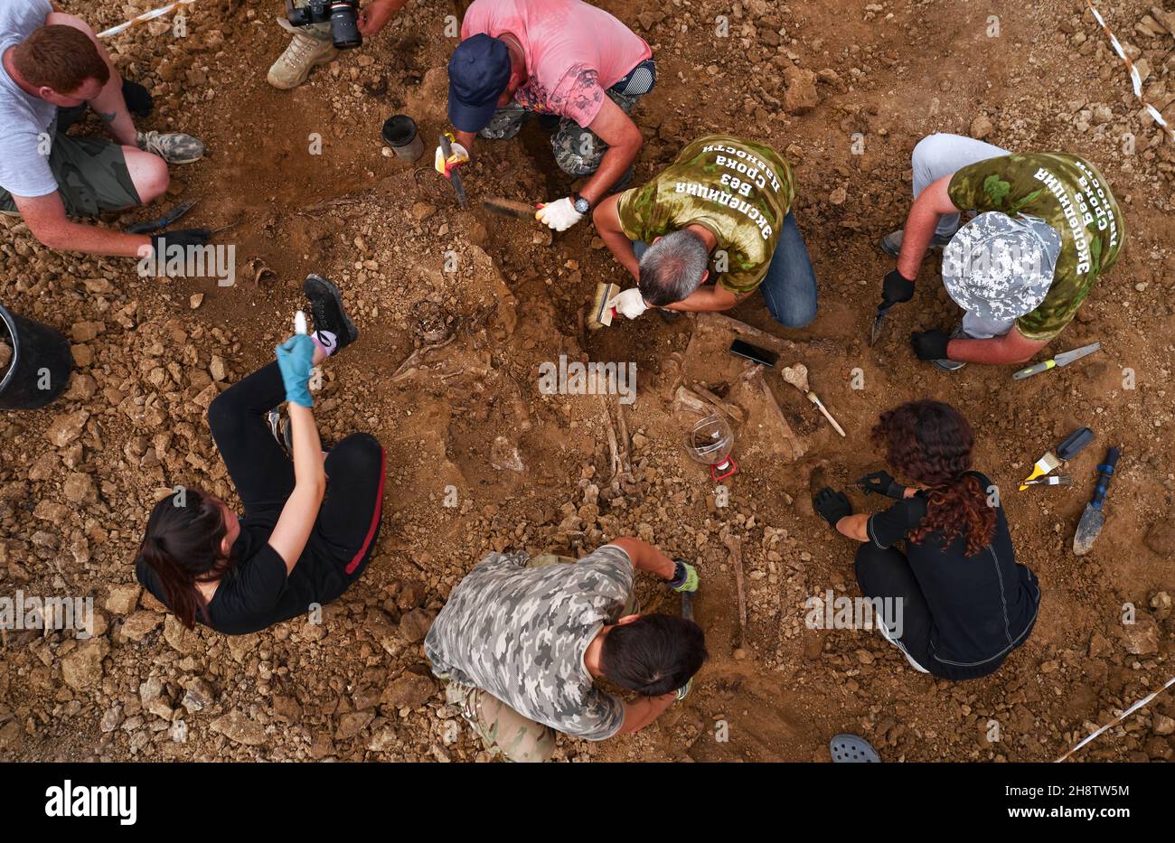 Excavations at the site of a war crime. Site of a mass shooting of ...
