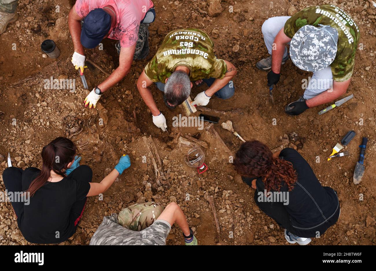 Excavations at the site of a war crime. Site of a mass shooting of ...