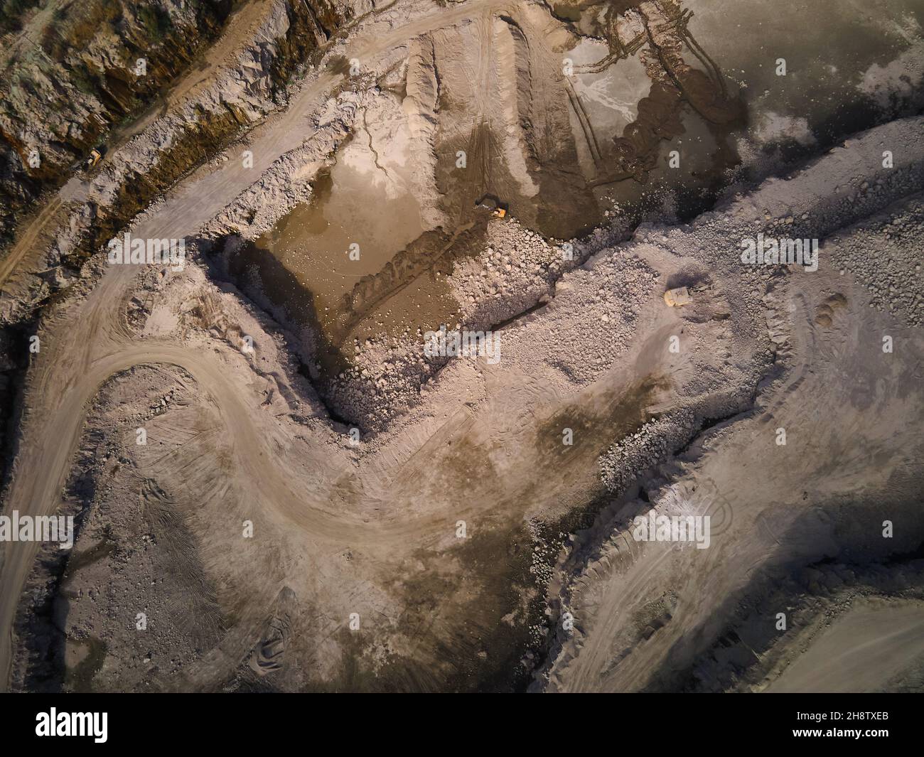 Aerial view of Slope operating granite quarry with mining equipment on ...