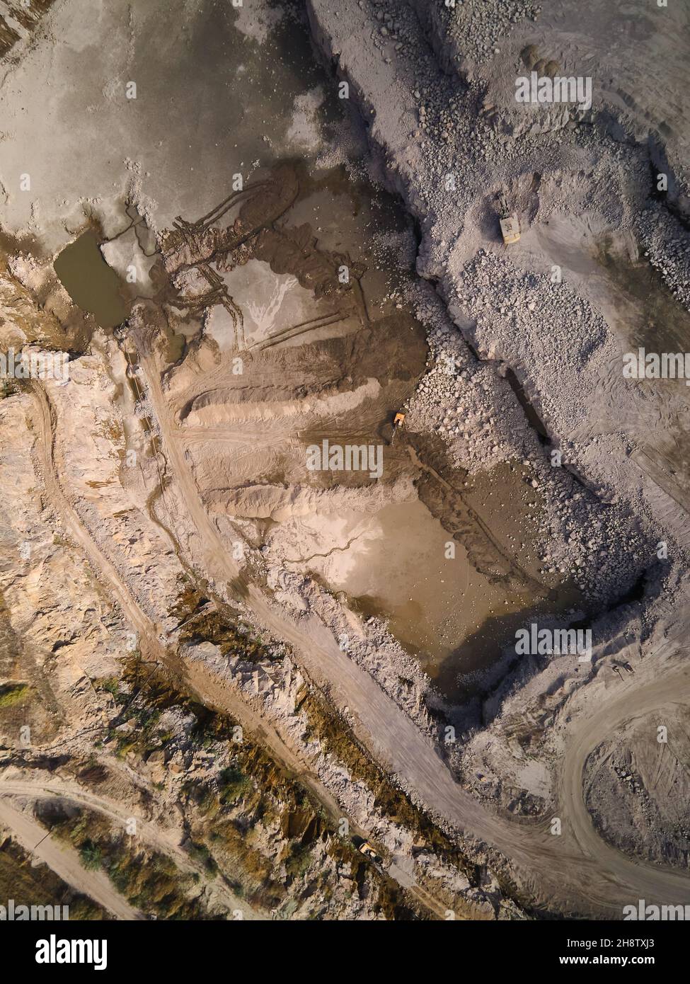 Aerial view of Slope operating granite quarry with mining equipment on ...