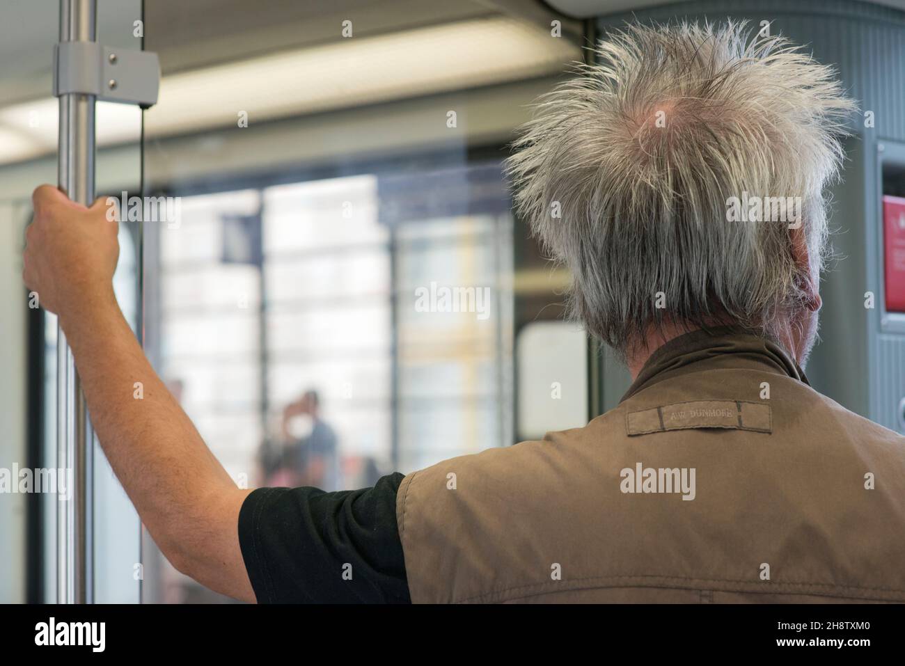 Berlin, Germany. Mature adult male commuting through the city using an ...