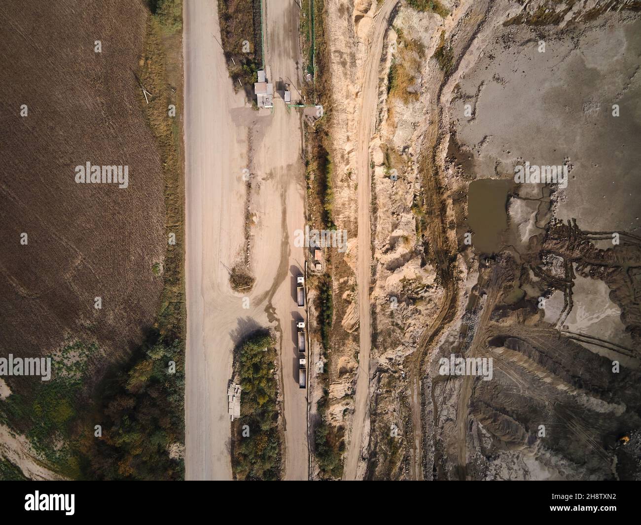 Aerial view of Slope operating granite quarry with mining equipment on ...